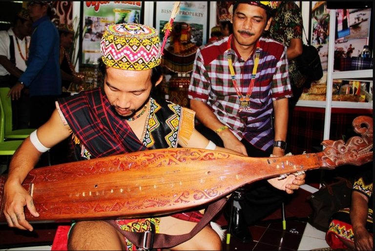 Sape, a musical instrument that accompanies the Dayak community dances